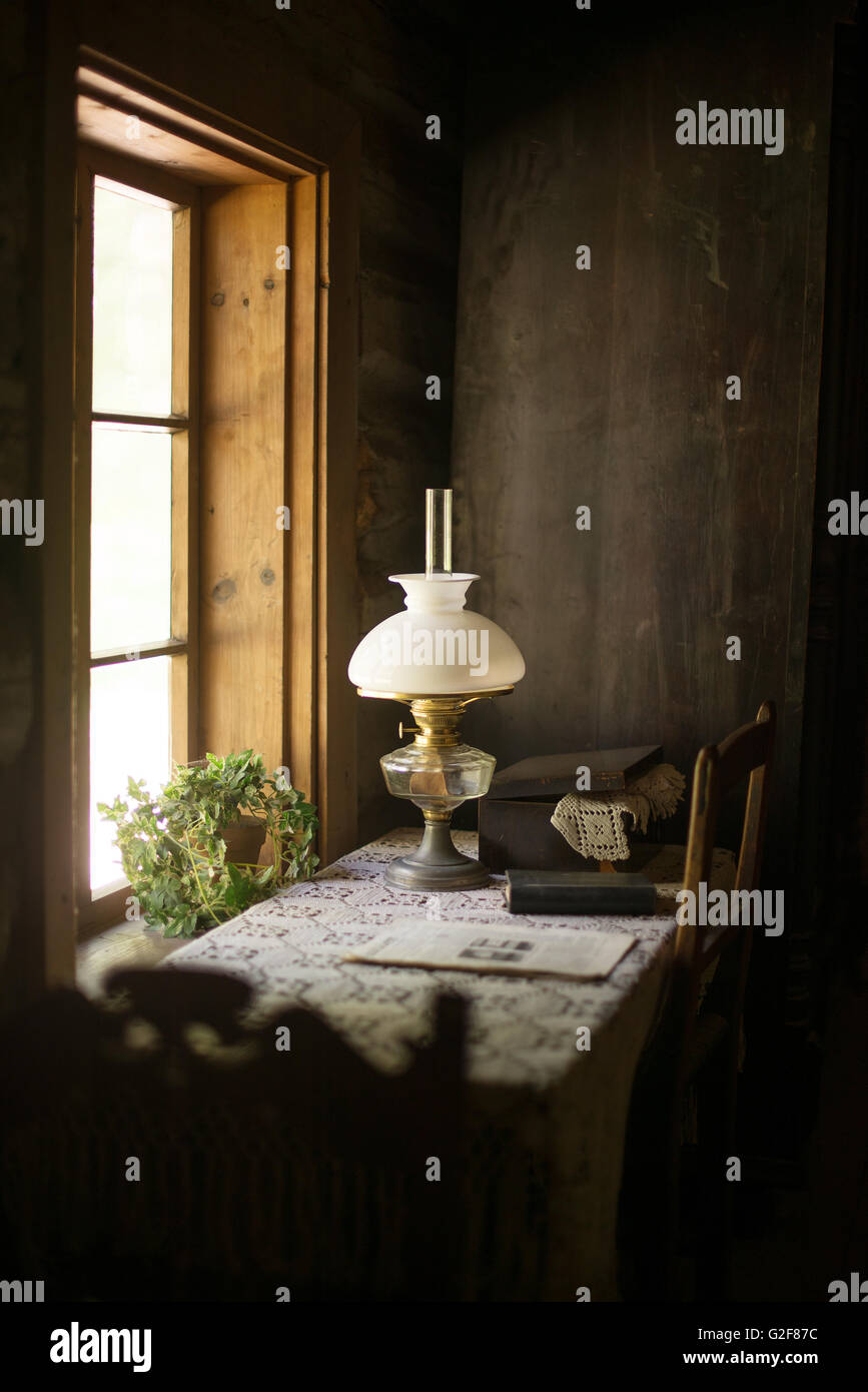 Ancient house interior with lamp and table Stock Photo - Alamy