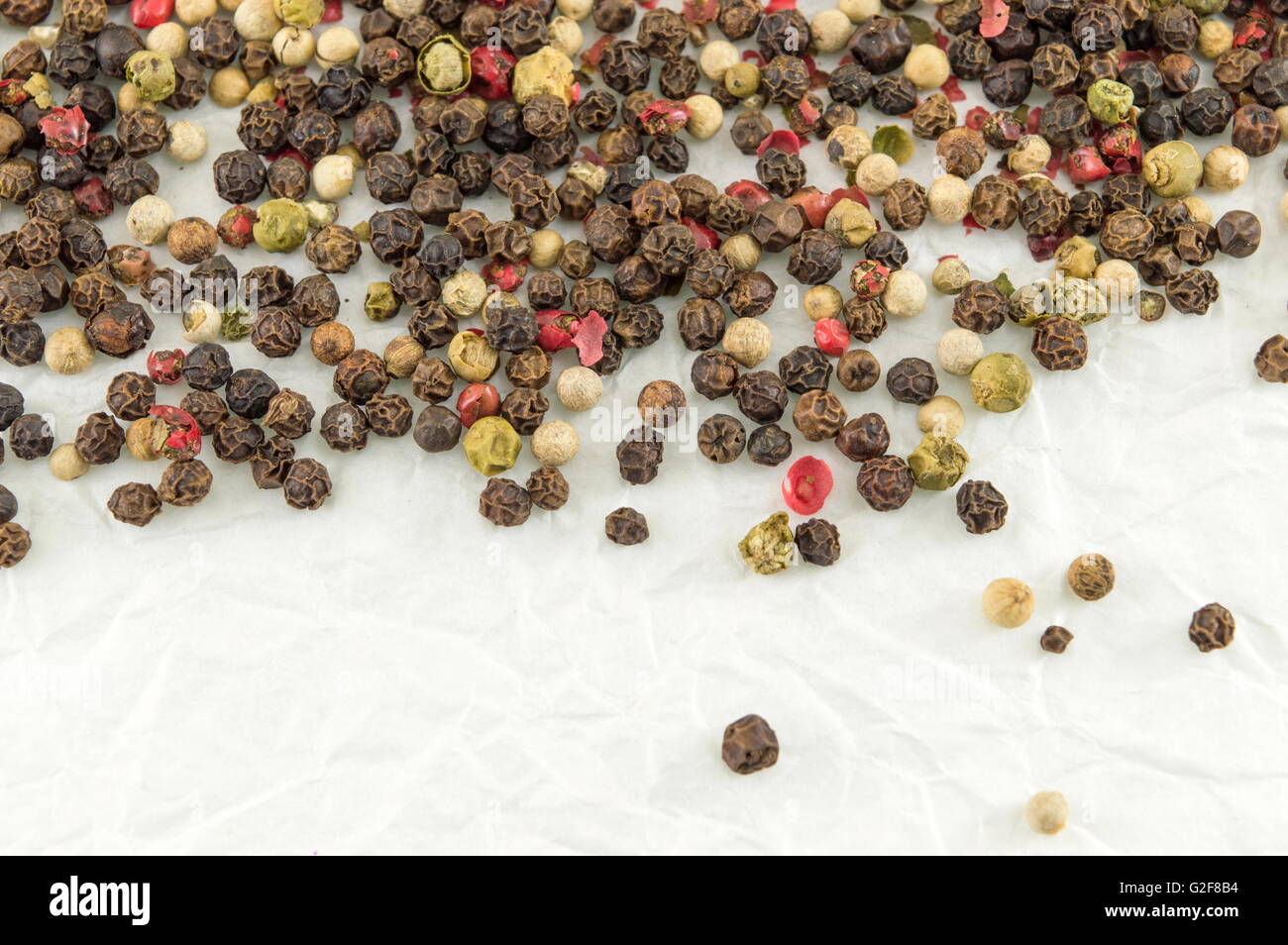 red and brown pepper balls on the white table Stock Photo - Alamy