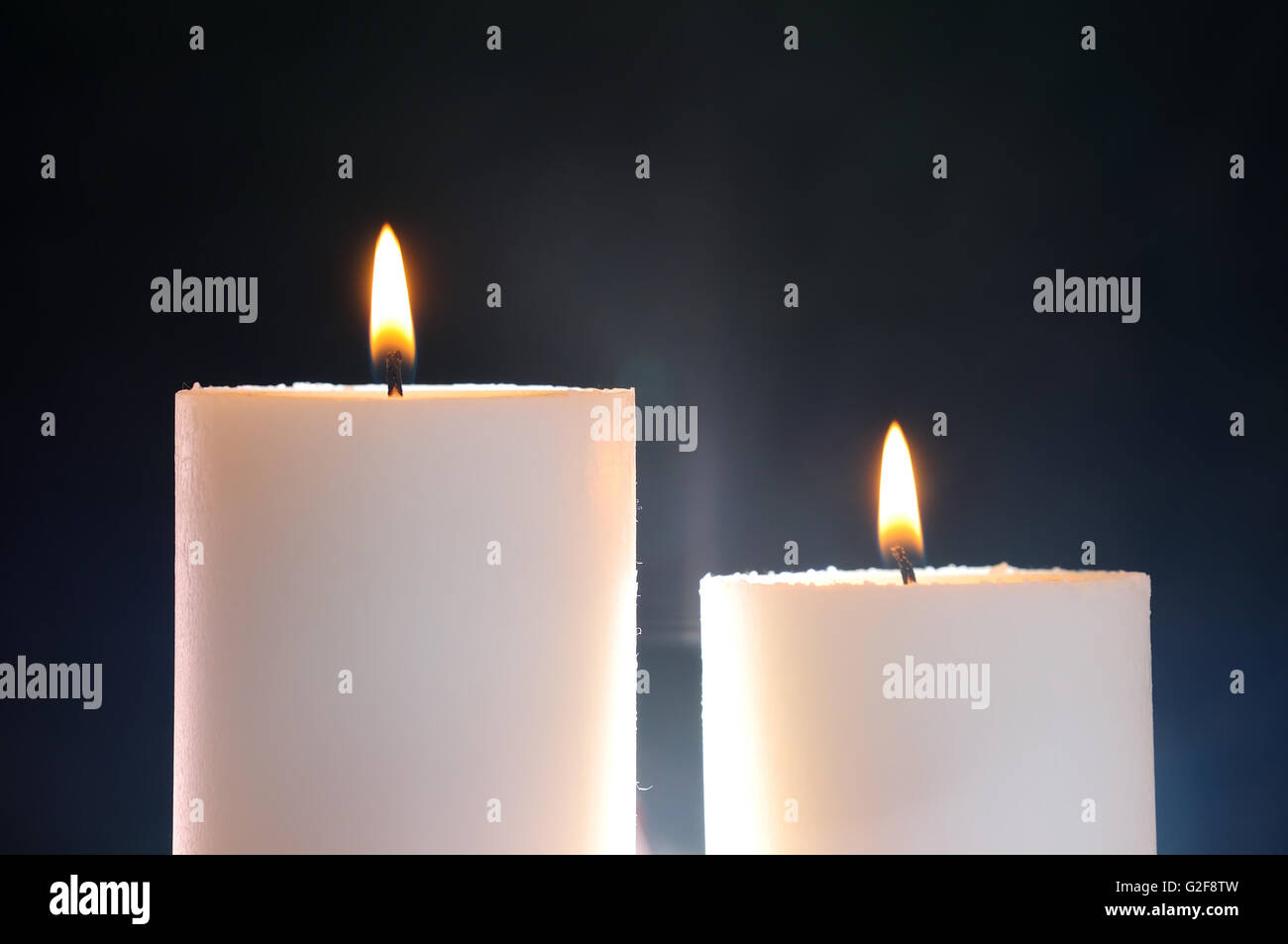 two candles lit and aura Stock Photo - Alamy