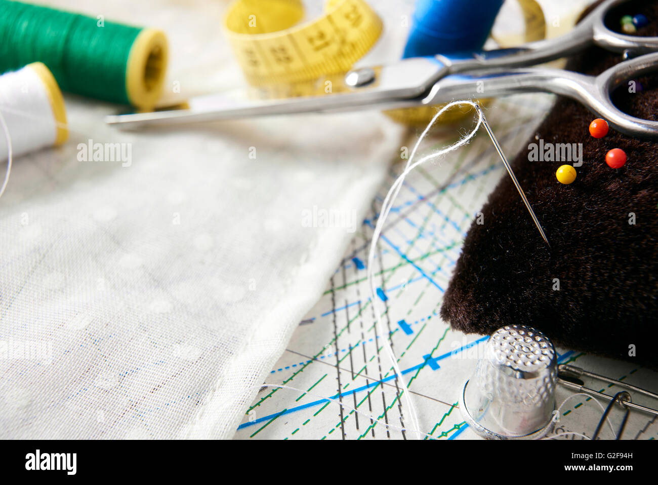 Tailoring tools on clothing pattern and fabric. Horizontal composition ...