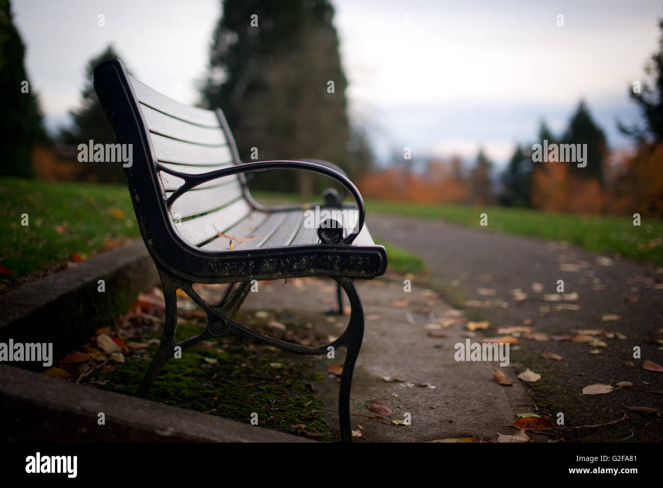 Park Bench Along Path Stock Photo - Alamy