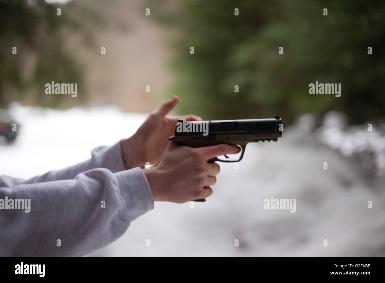 Man Aiming Handgun, Profile Stock Photo - Alamy