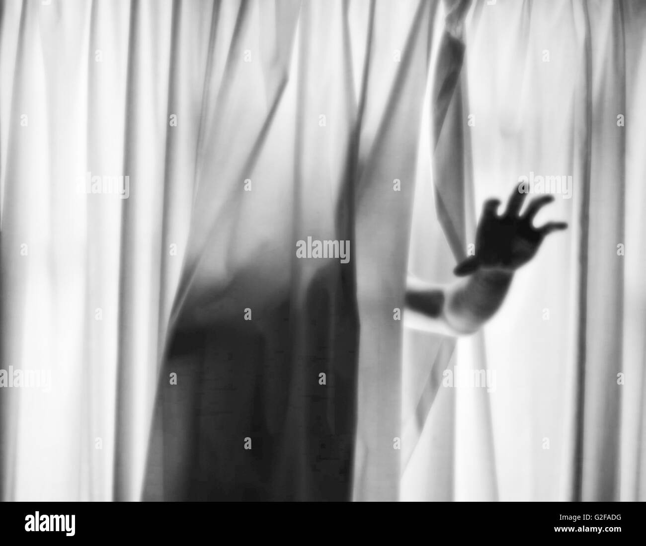 Hand Reaching out from Curtains Stock Photo - Alamy
