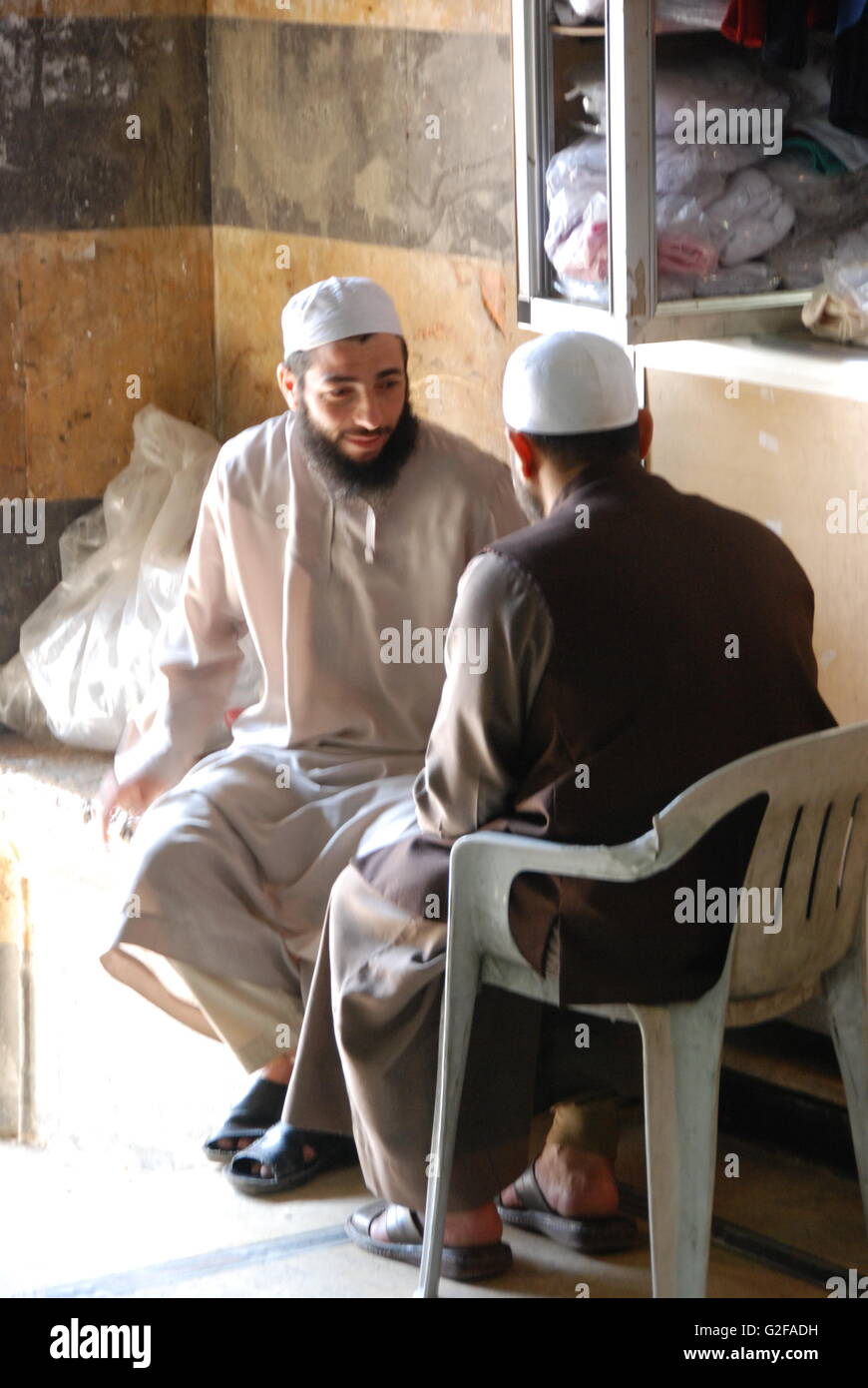 Aleppo - The Souqs, Two Muslim Men Chatting Stock Photo - Alamy