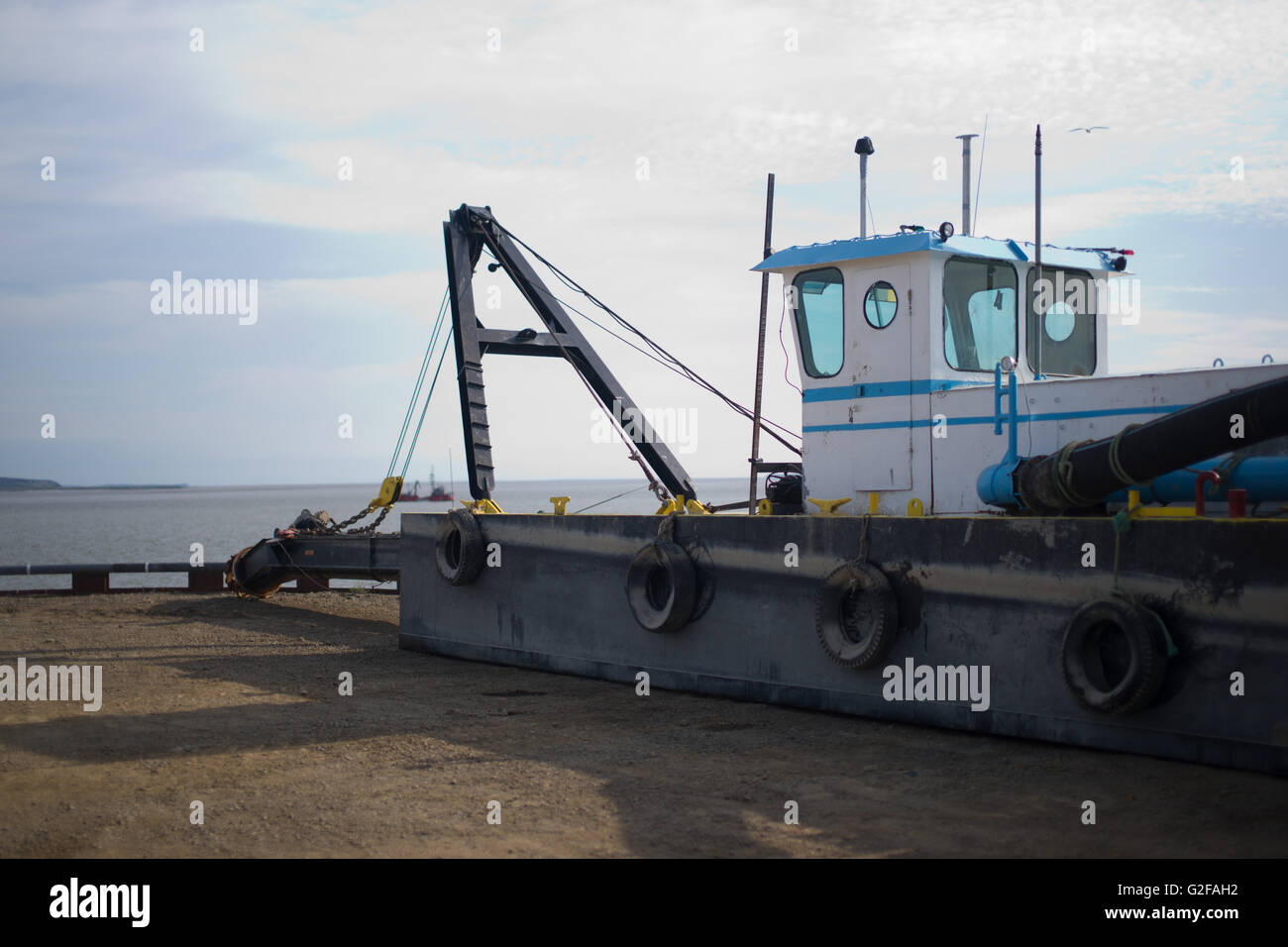 Fishing Boat on Dock Stock Photo - Alamy