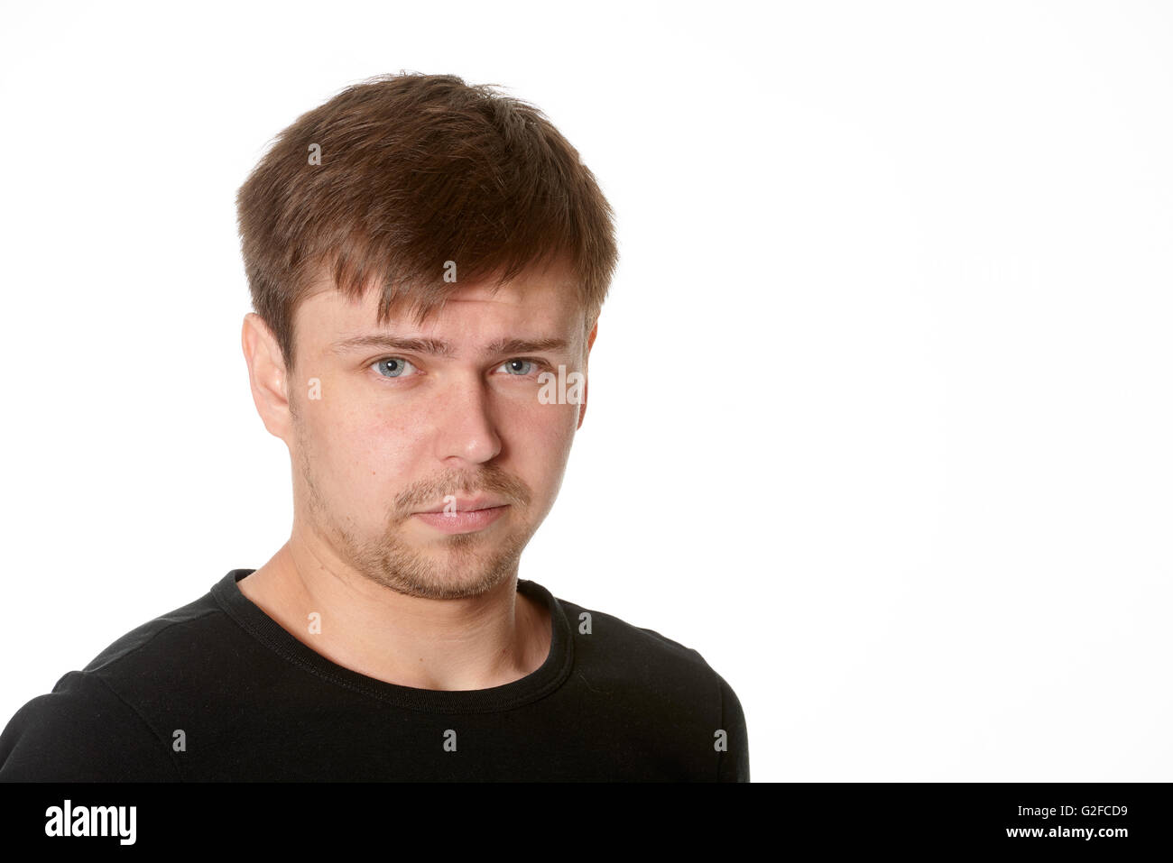 Serious young man, questioning expression,horizontal on white ...