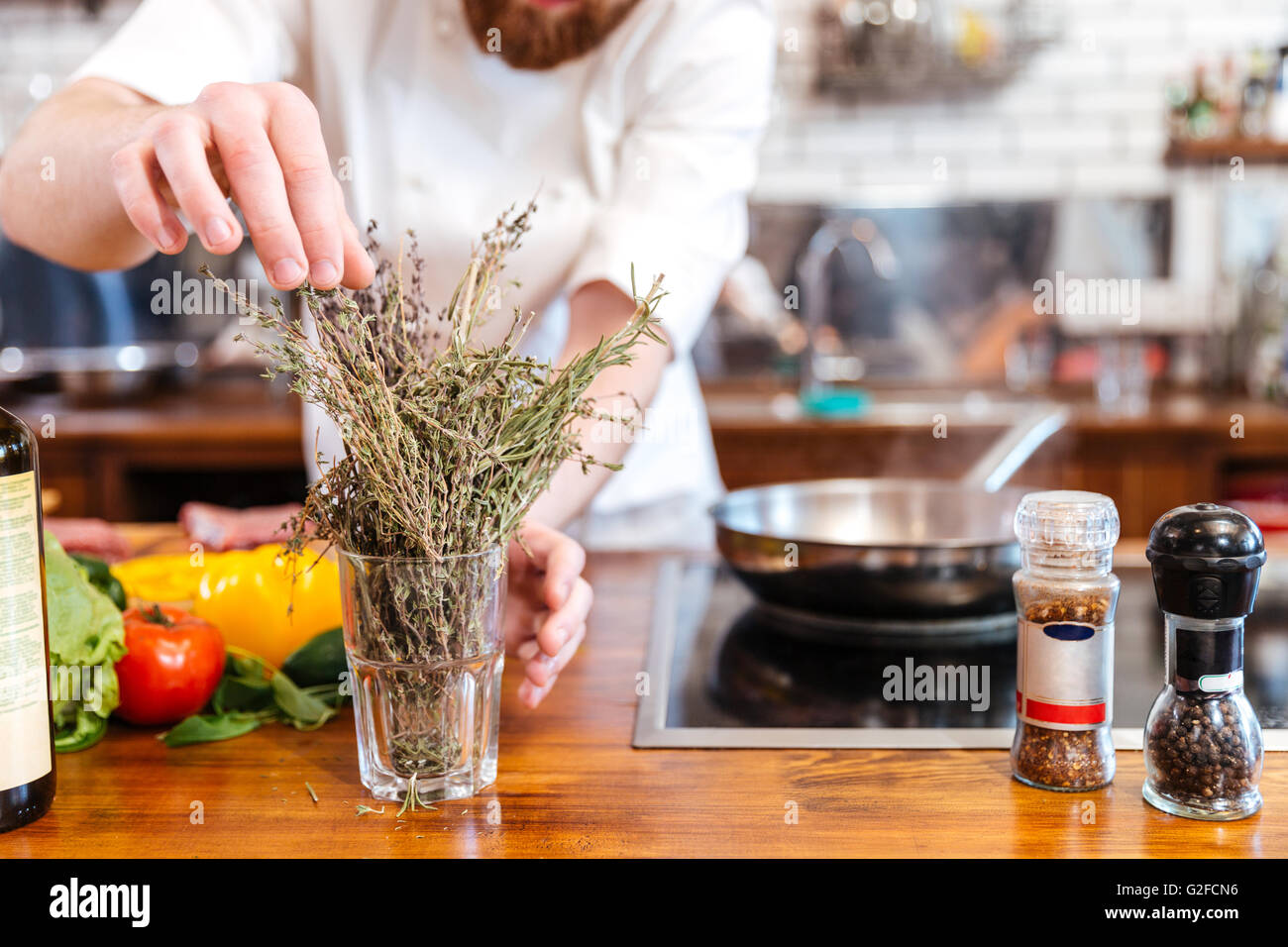 Cropped image of a chef cook preparing food in the kitchen Stock Photo ...