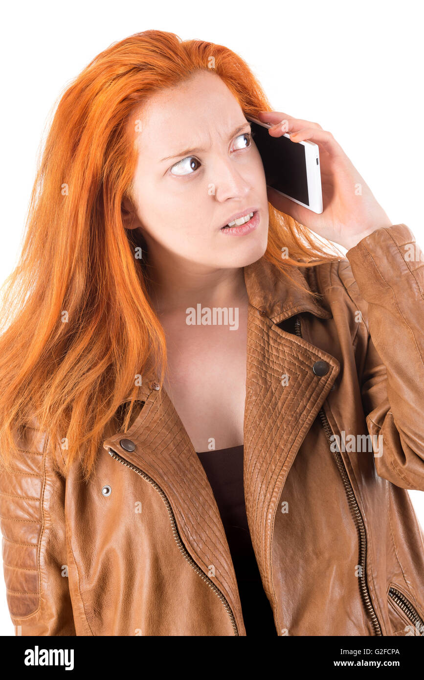 Stressed red hair girl with cellphone isolated in white Stock Photo - Alamy
