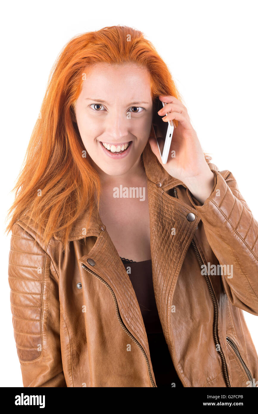 Beautiful red hair girl with cellphone isolated in white Stock Photo ...