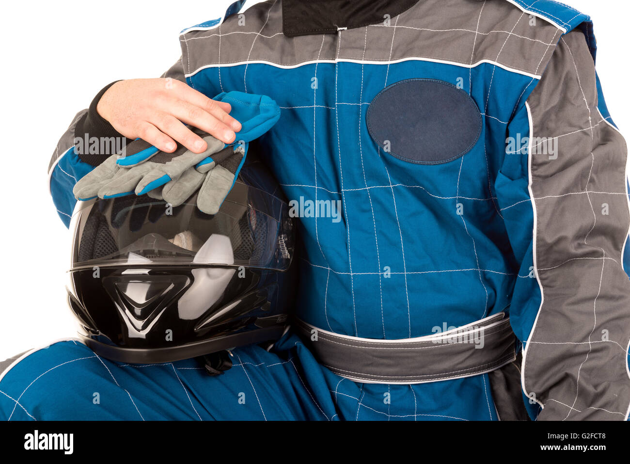 Racing driver body part posing with helmet and gloves isolated in white ...