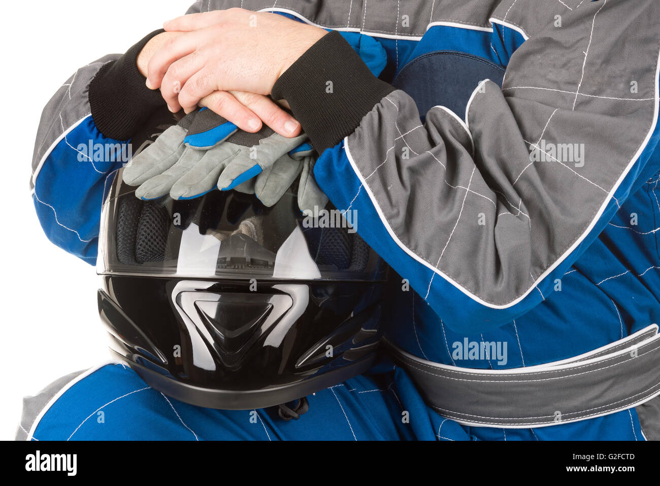 Racing driver body part posing with helmet and gloves isolated in white ...