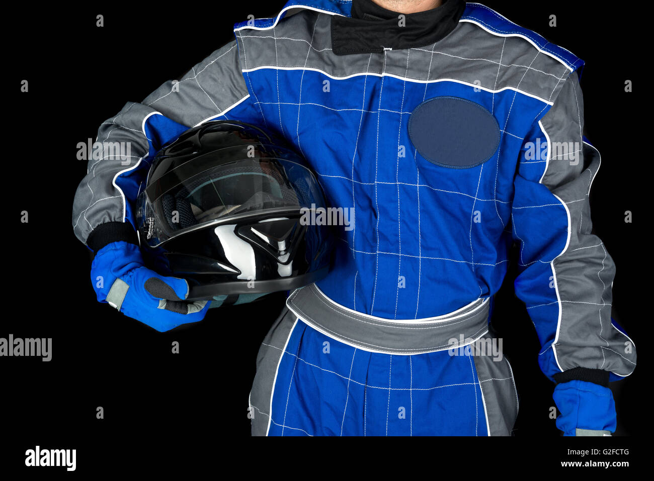 Racing driver body-part with helmet isolated in black Stock Photo - Alamy