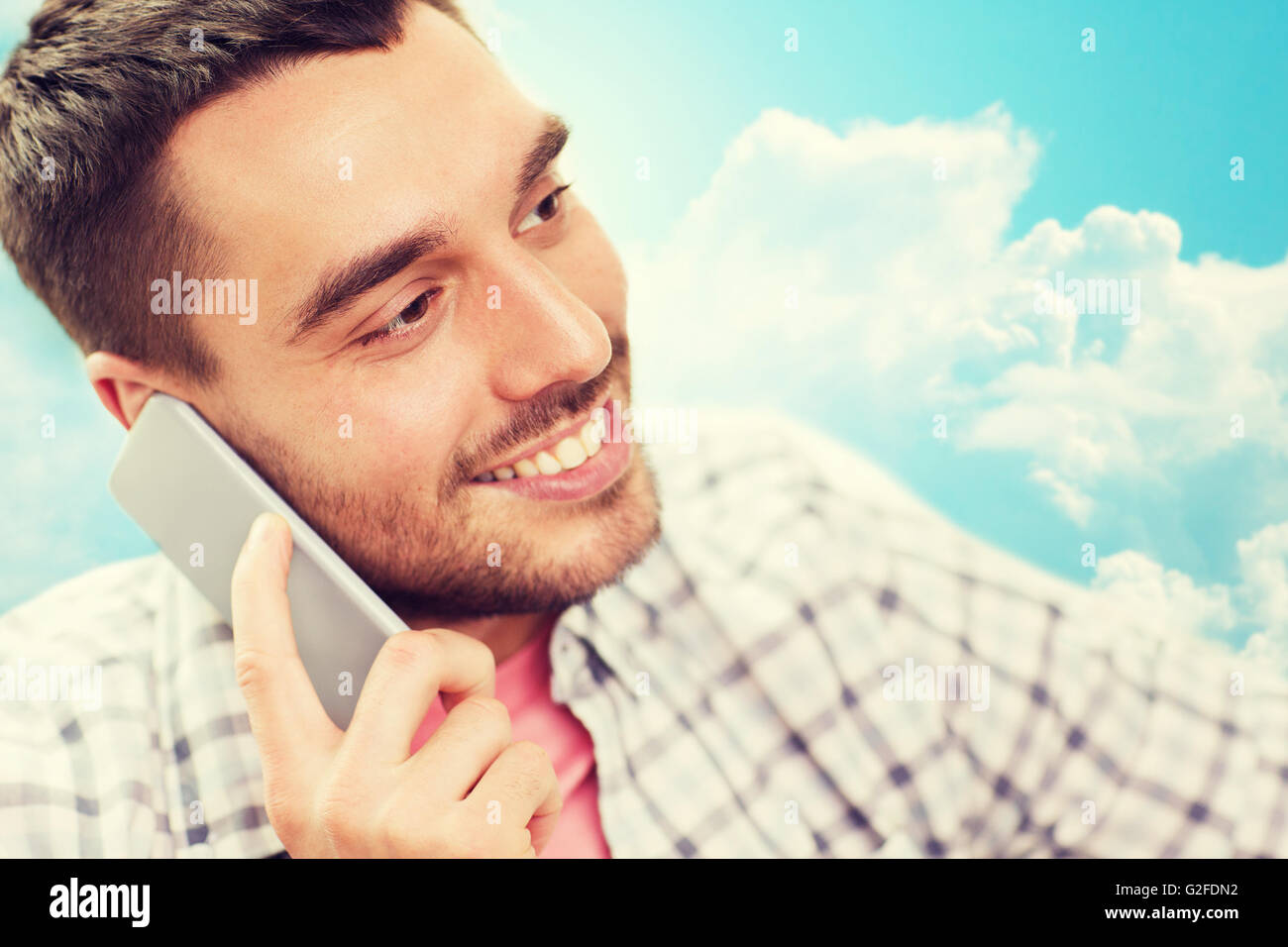 Smiling young man smartphone making hi-res stock photography and images ...