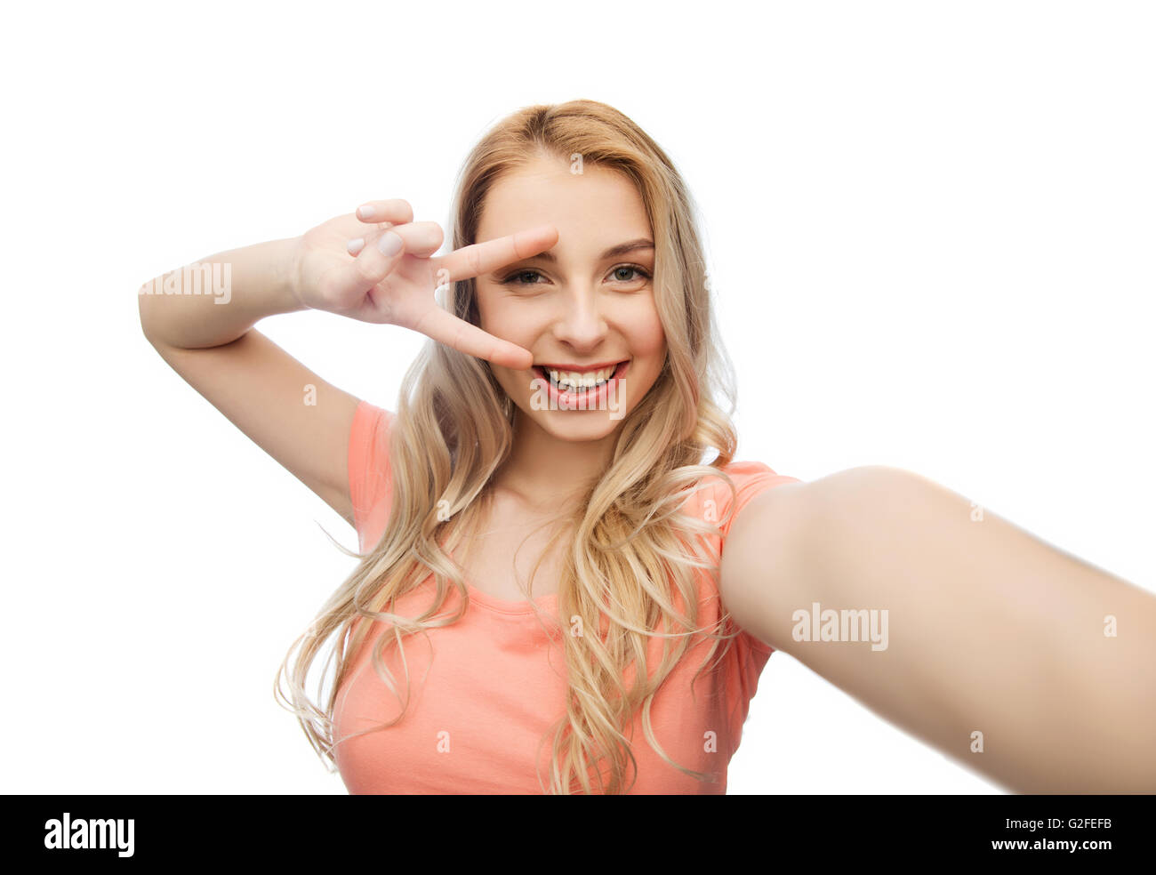 smiling woman taking selfie and showing peace sign Stock Photo - Alamy