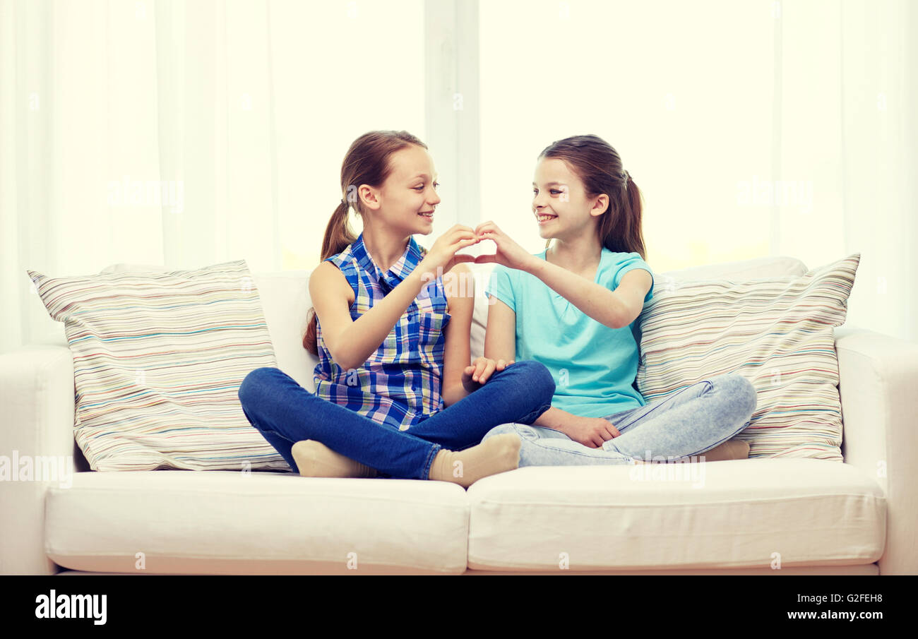 happy little girls showing heart shape hand sign Stock Photo - Alamy