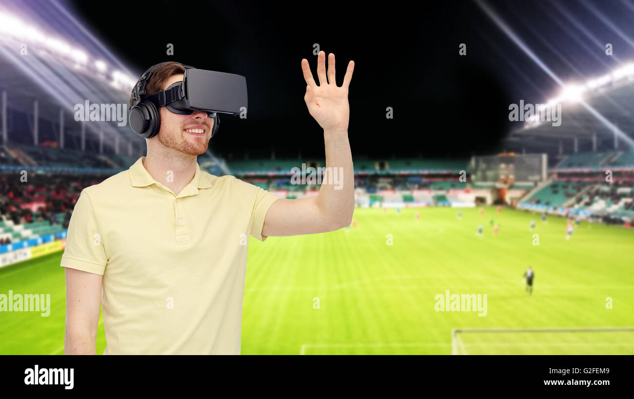 man in virtual reality headset over football field Stock Photo - Alamy