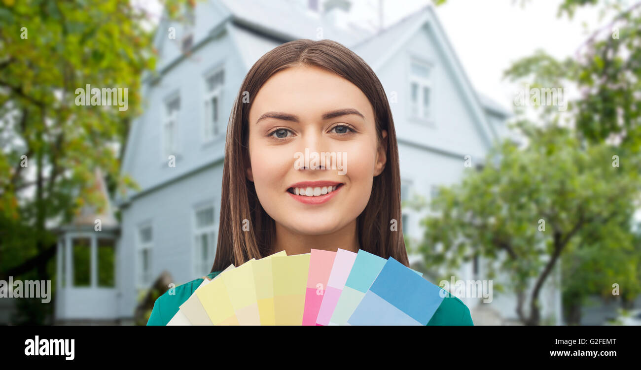 smiling young woman with color swatches Stock Photo - Alamy