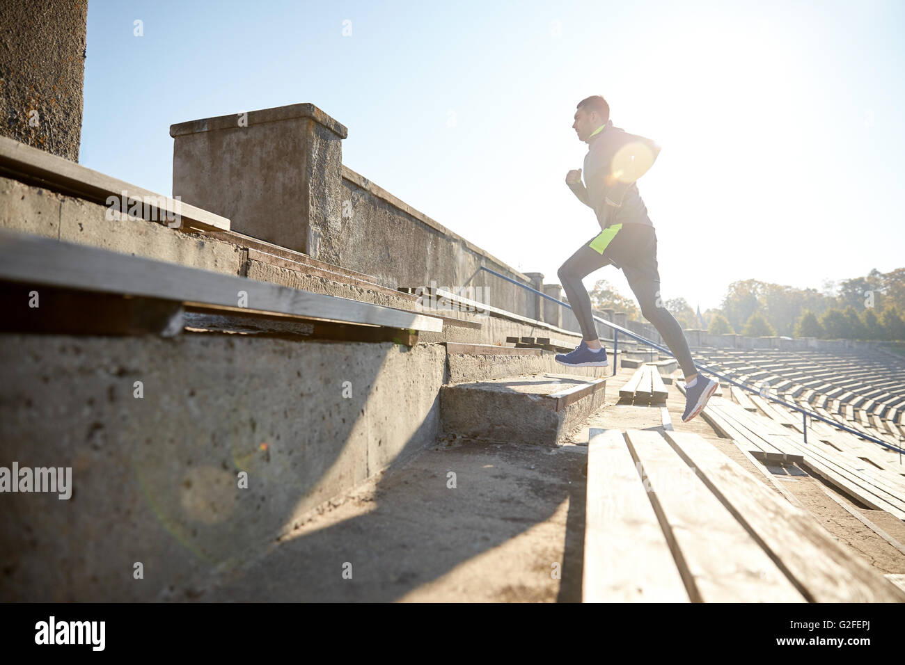 Happy young man running upstairs hi-res stock photography and images ...