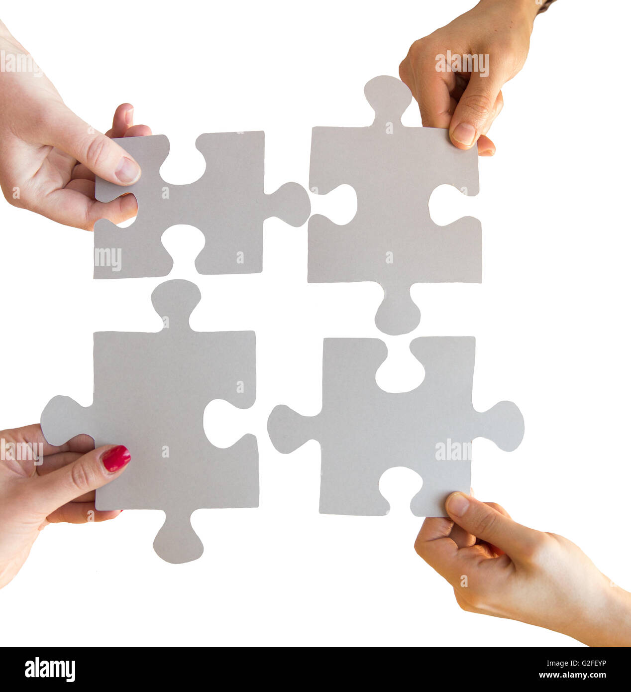 close up of hands connecting puzzle pieces Stock Photo - Alamy