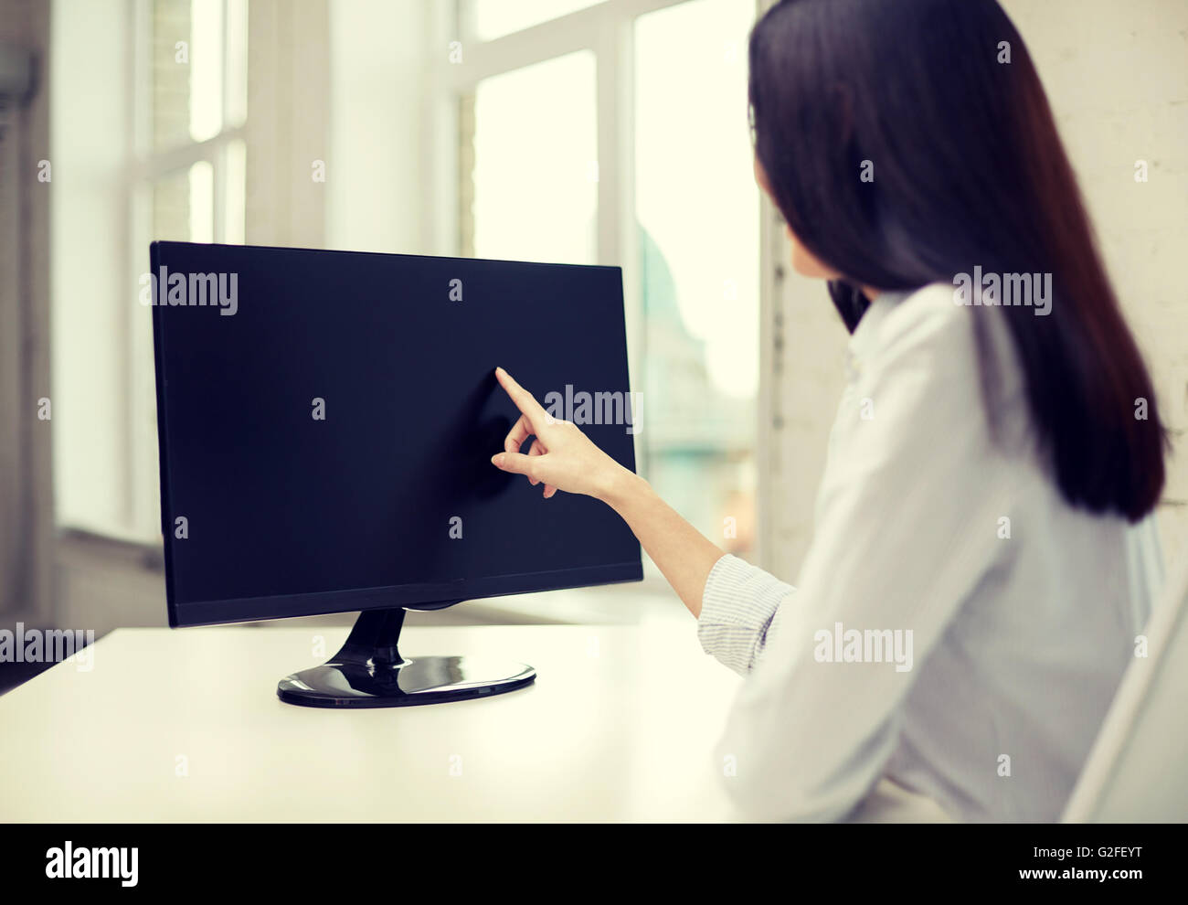 close up of woman with computer monitor in office Stock Photo - Alamy