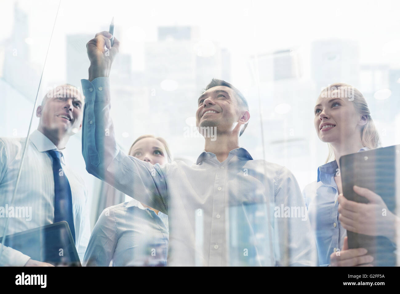 smiling business people with marker and stickers Stock Photo - Alamy