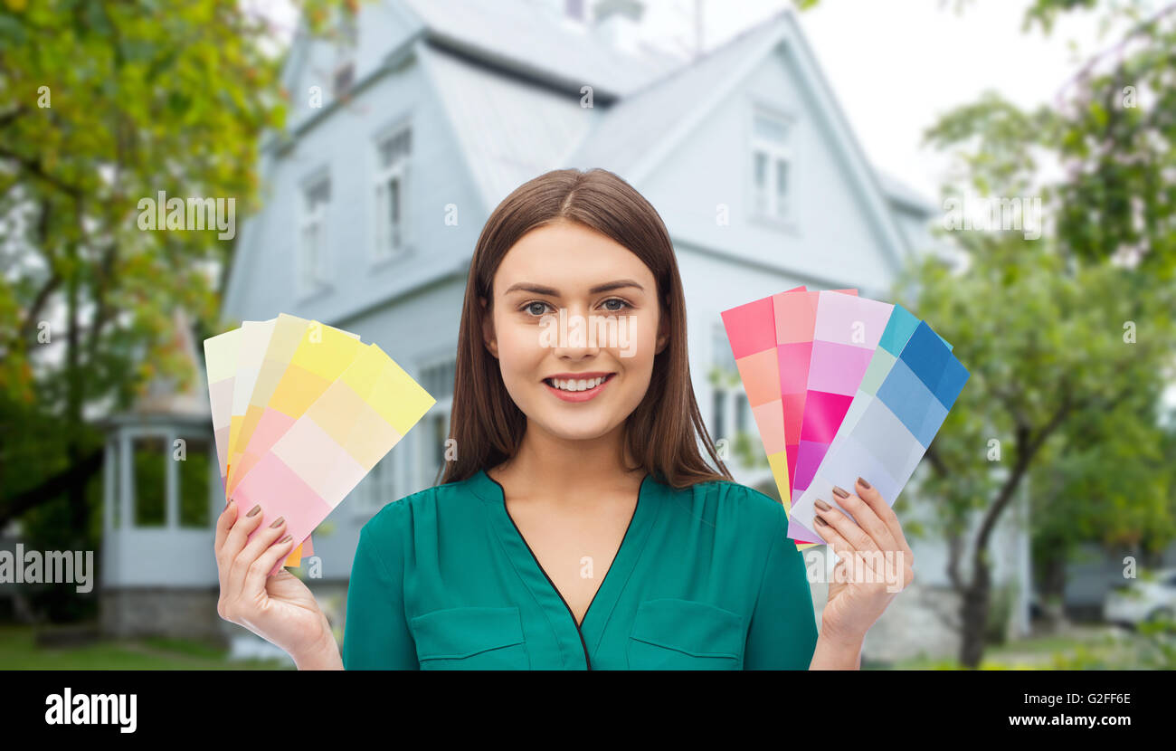 smiling young woman with color swatches Stock Photo - Alamy
