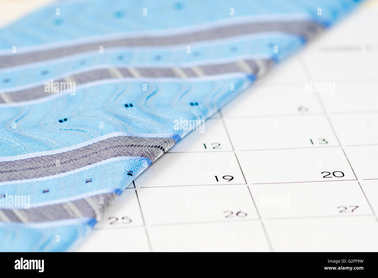 paper calendar with necktie background Stock Photo - Alamy