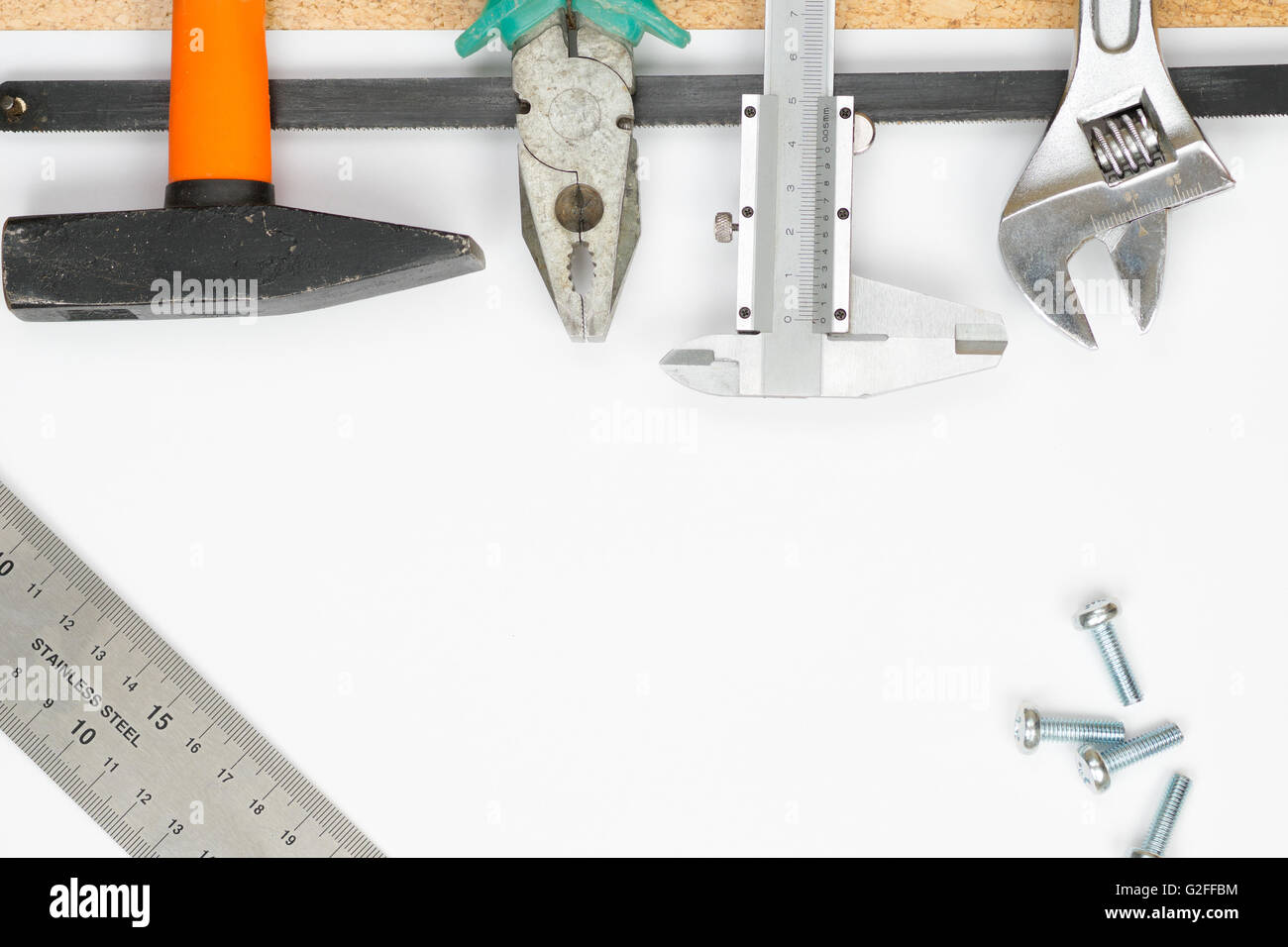 tools on paper sheet wooden abstract background Stock Photo - Alamy