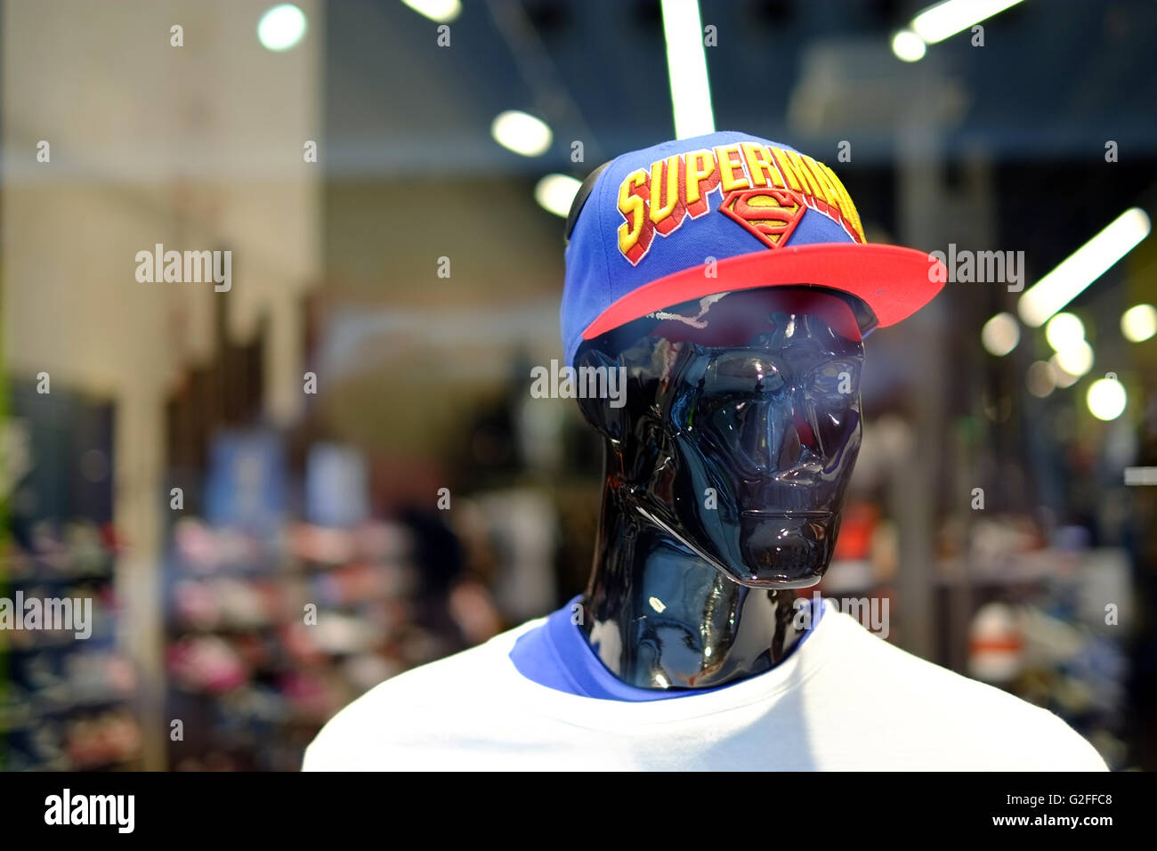 Mannequin with Superman baseball cap in a store window Stock Photo - Alamy