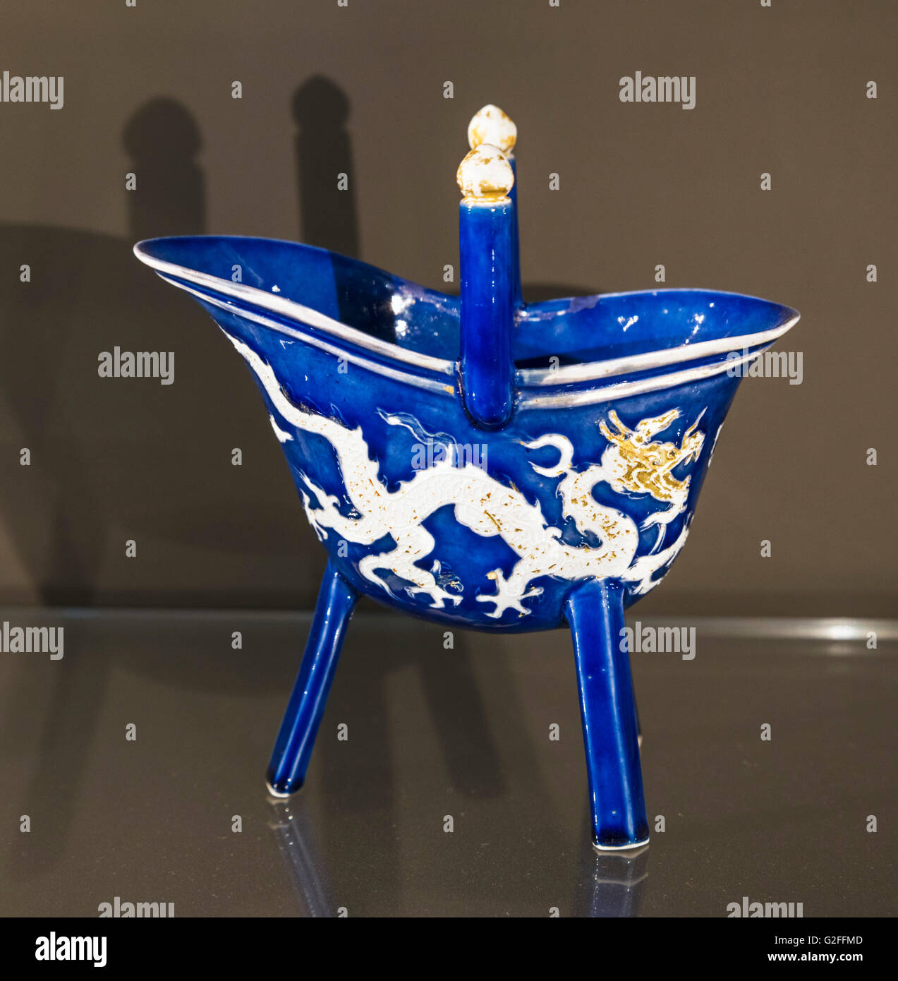 Porcelain libation vessel of ancient bronze jue form with three legs, a ...