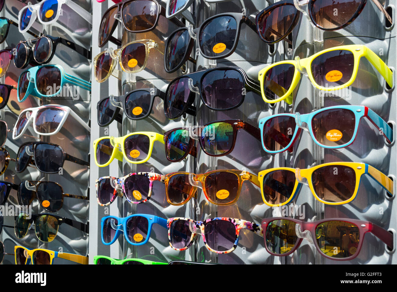 Sunglasses for sale on display Stock Photo - Alamy