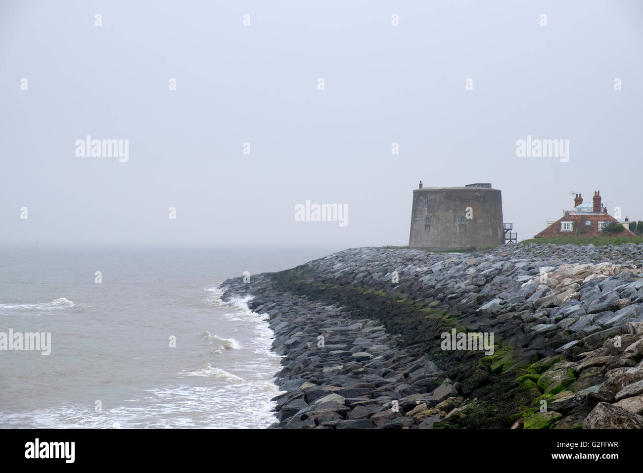 Rock armour protecting a Martello Tower and homes at East Lane Bawdsey ...