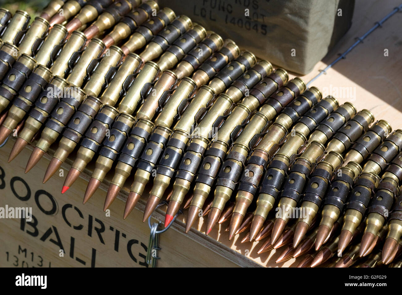 Metal belt with machine gun cartridges Stock Photo - Alamy