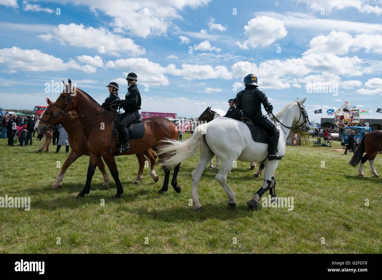 Police patrol on horses at an event Stock Photo - Alamy