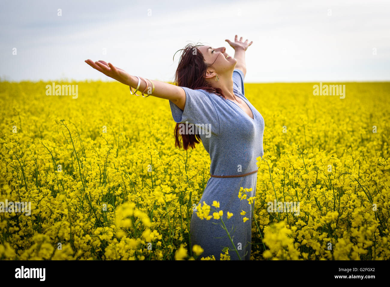 Freedom and dancing in a field Stock Photo - Alamy