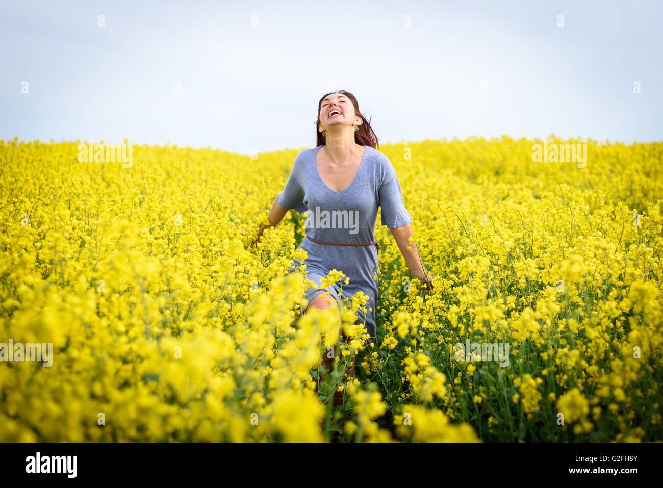 singing, dancing and walking in a field Stock Photo - Alamy