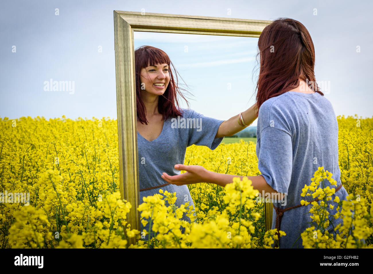 Reflection in mirror smiling Stock Photo - Alamy