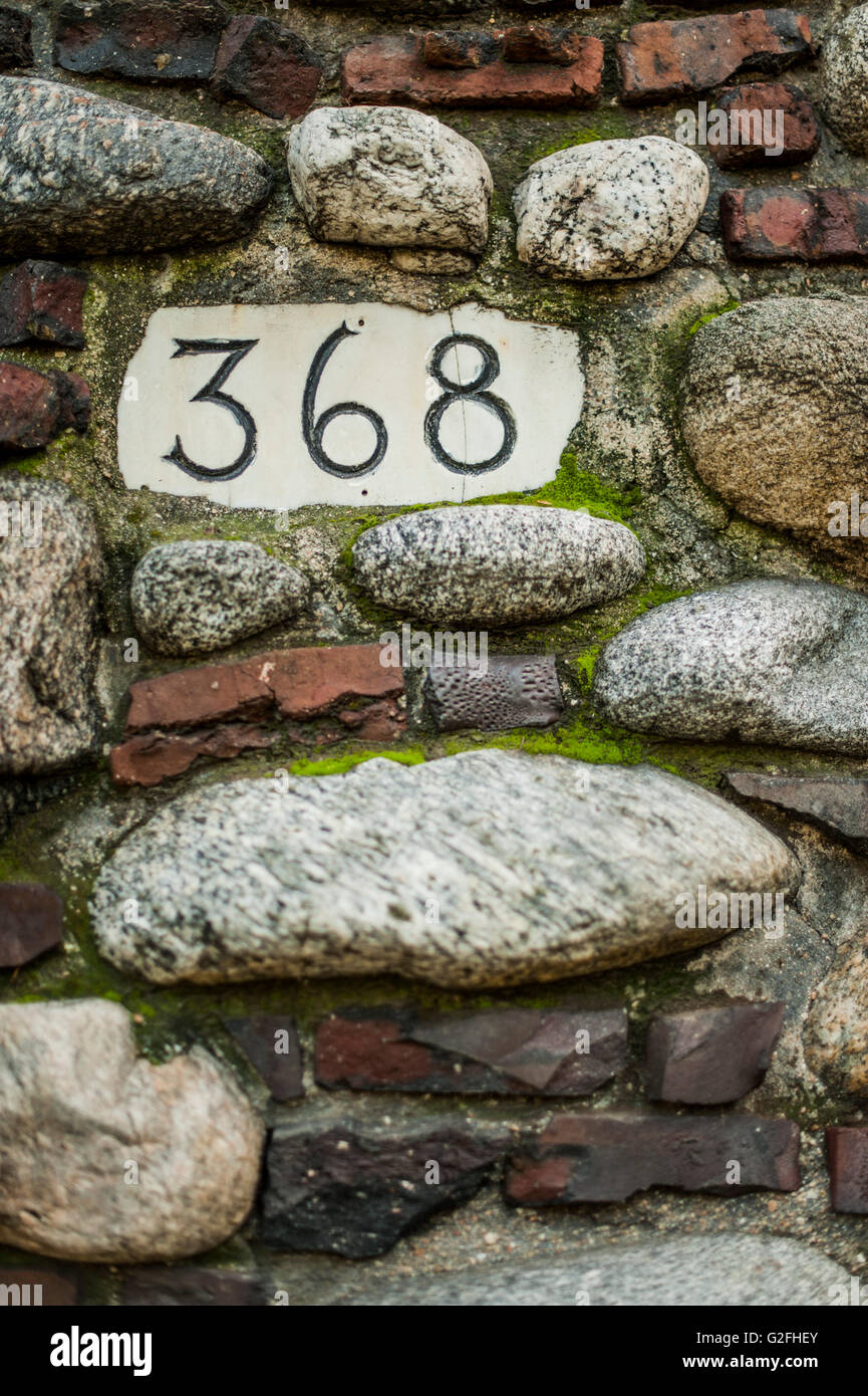 House Number in Stone Wall Stock Photo - Alamy