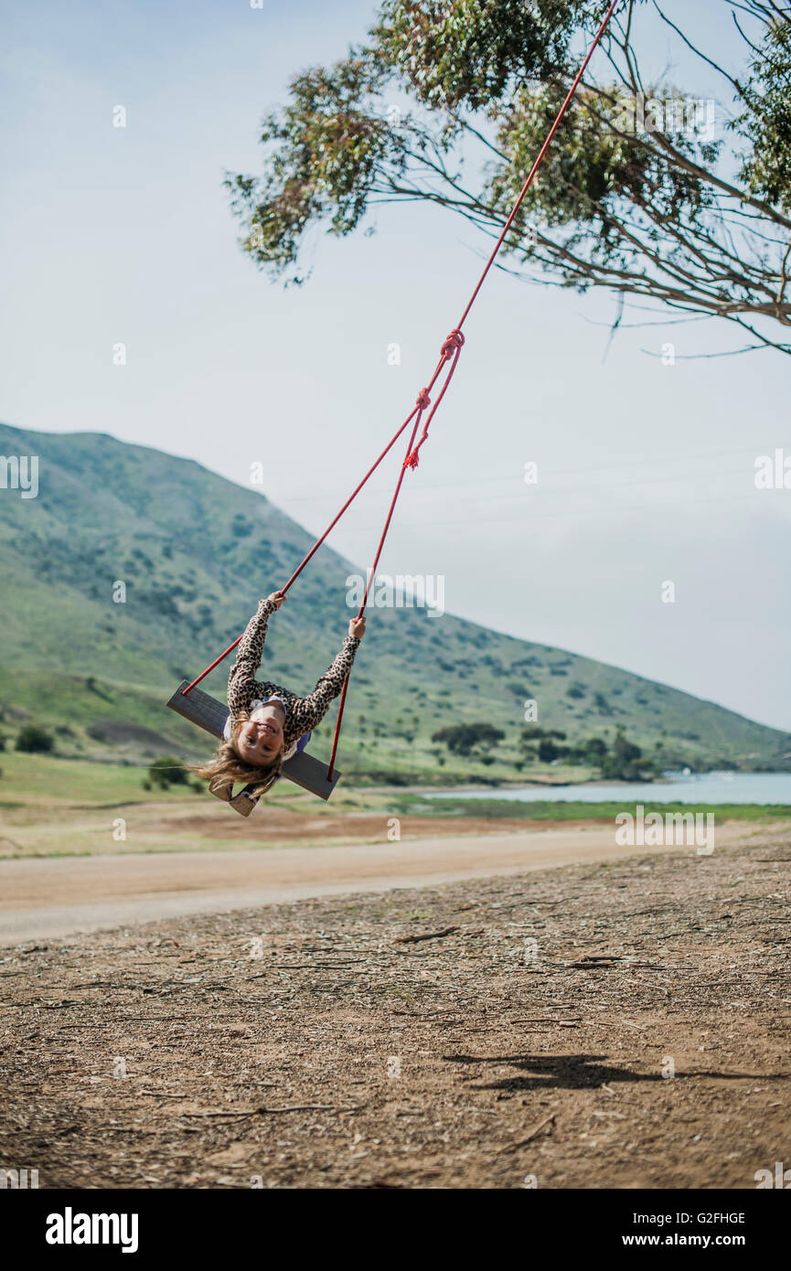 Child swing tree playing hi-res stock photography and images - Alamy