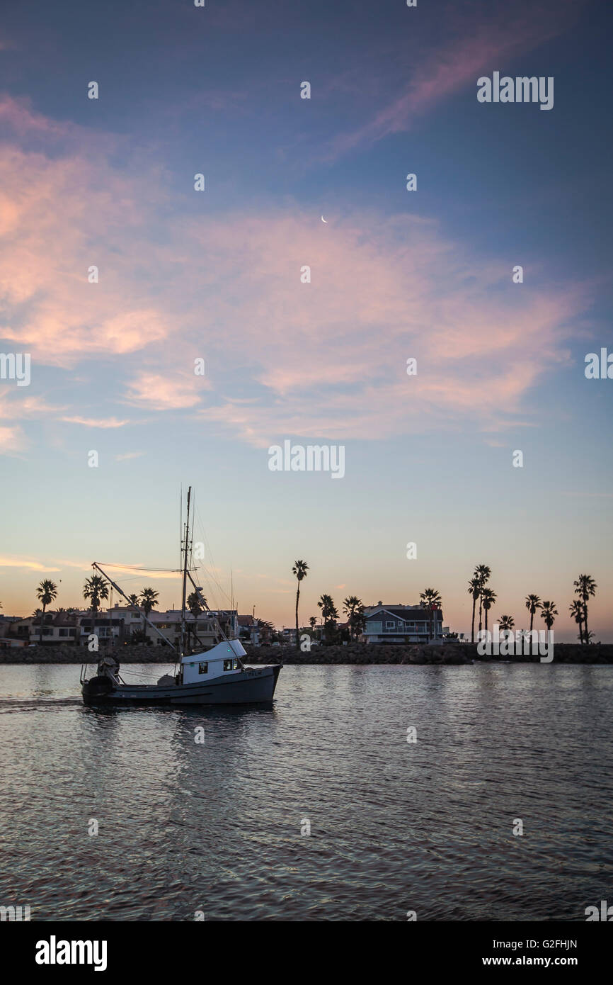 Fishing Boat Heading out to Sea Stock Photo - Alamy