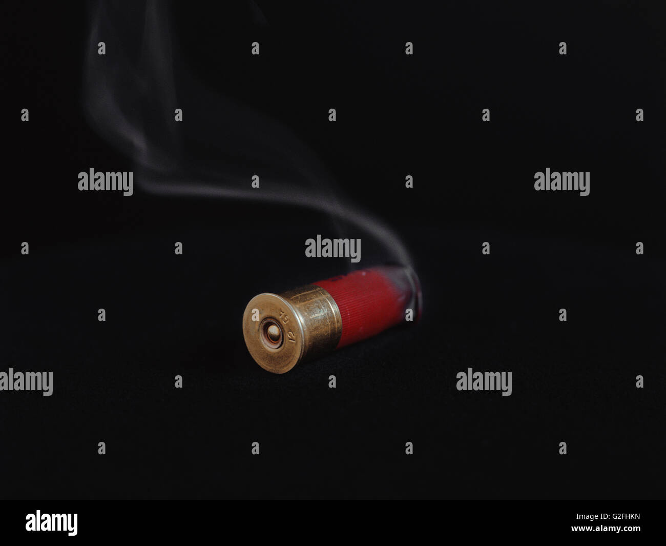 Smoking Shotgun Shell Stock Photo - Alamy