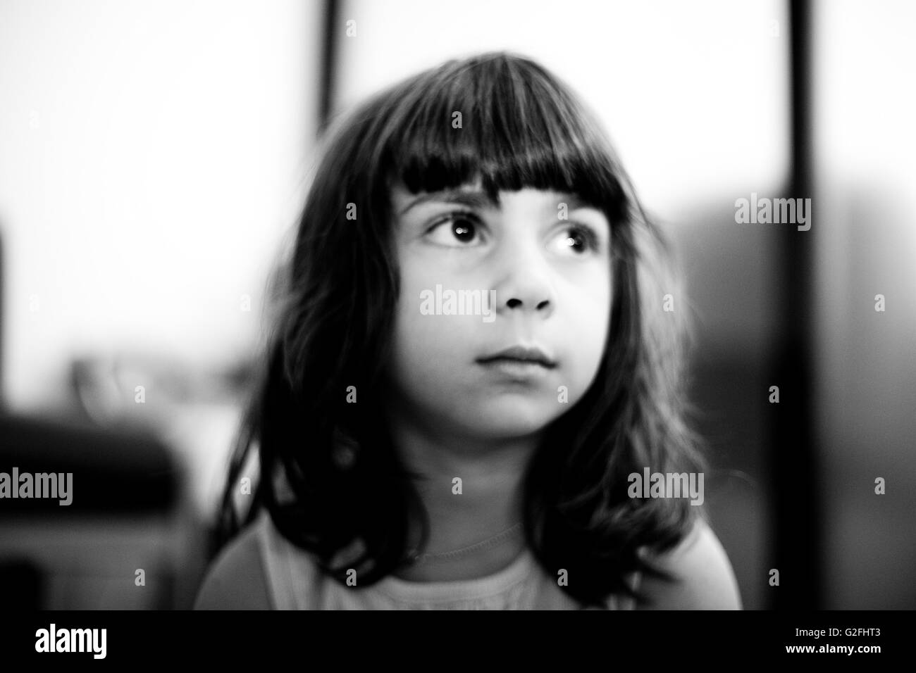 Little Girl Looking Off to Side Stock Photo - Alamy