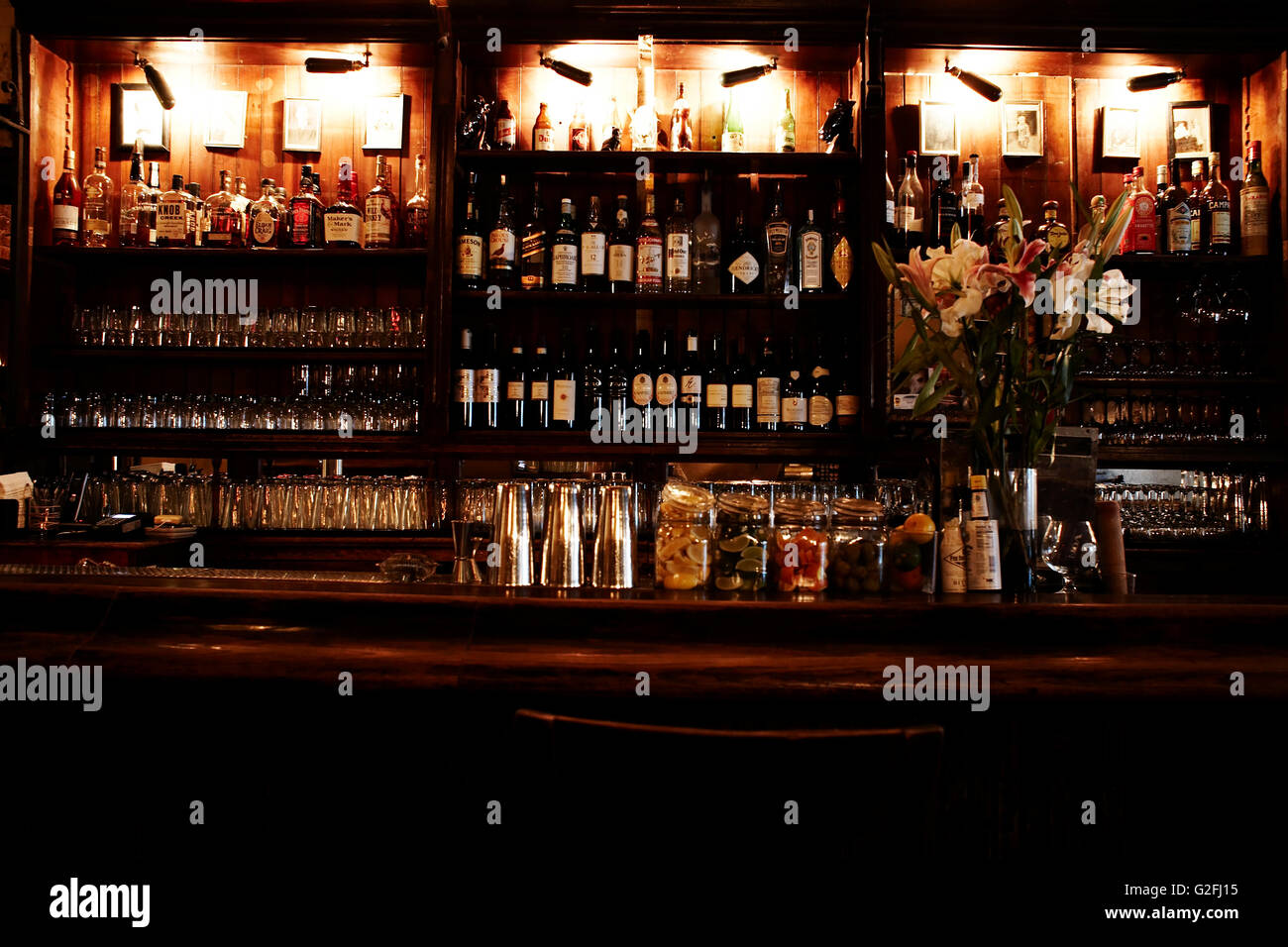 Bar With Shelves of Liquor Bottles Stock Photo - Alamy