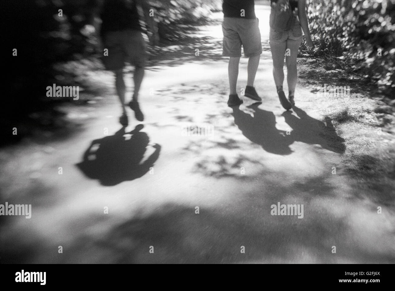 Three people walking rear view hi-res stock photography and images - Alamy