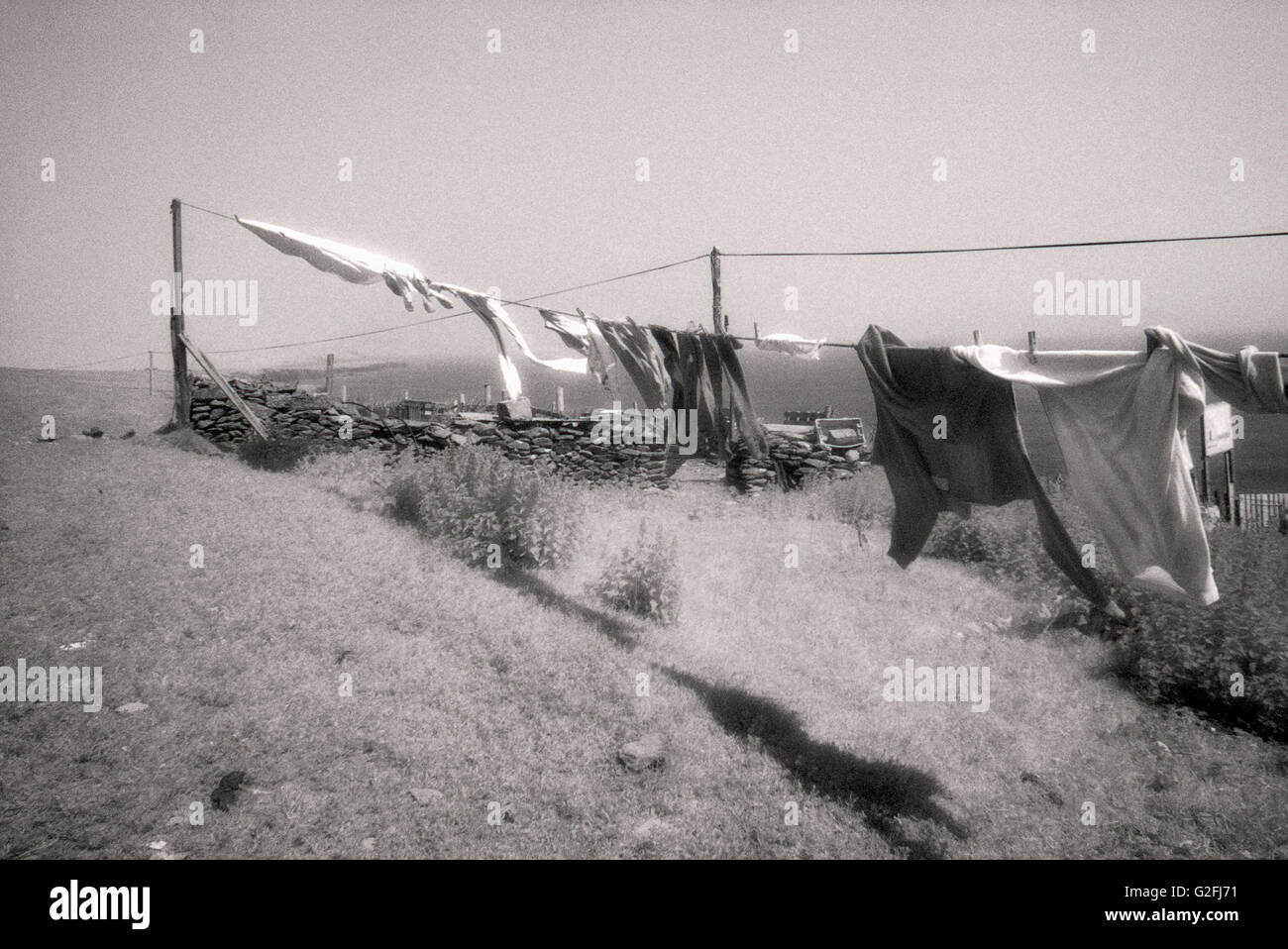 Laundry on Clothesline Blowing in Wind near Coast Stock Photo - Alamy