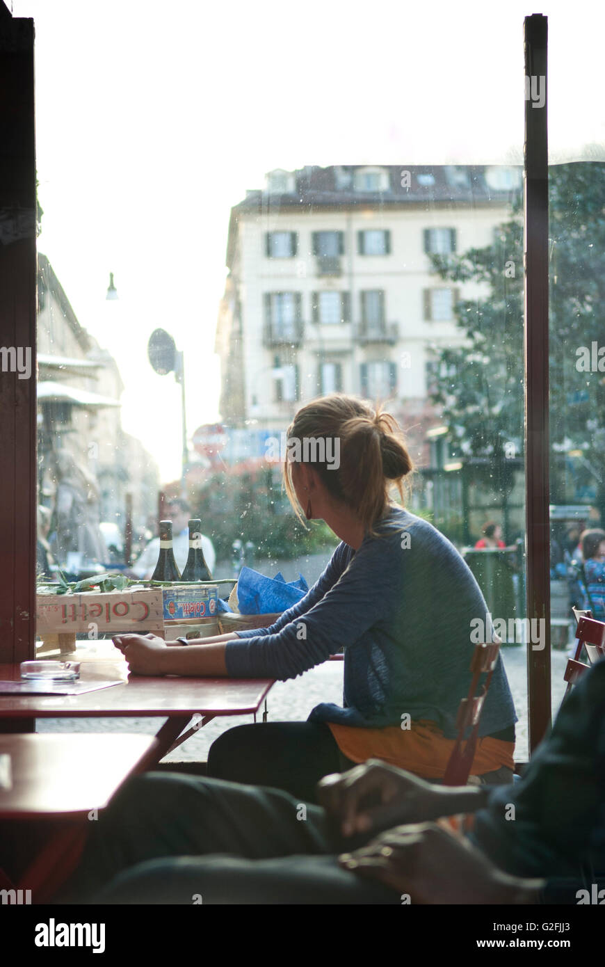Woman sitting in café hi-res stock photography and images - Alamy