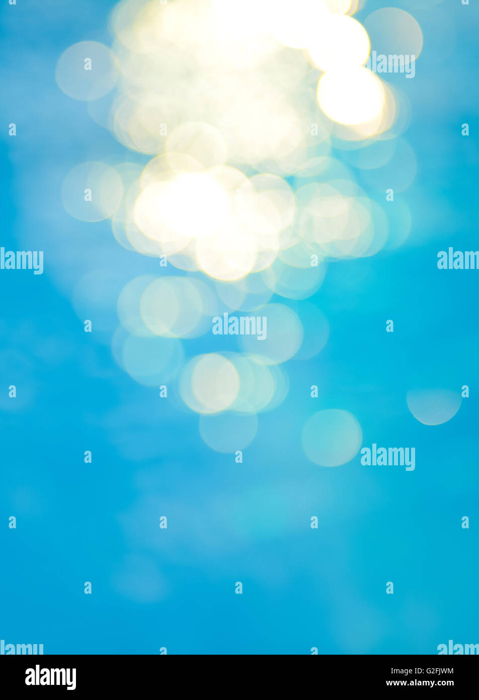 Soft focus bokeh light effects over a rippled, blue water background in the pool Stock Photo - Alamy