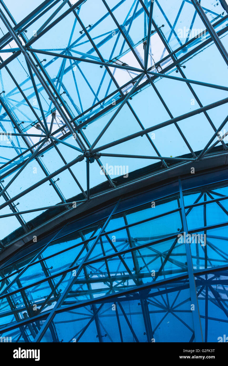 Bottom view of modern glass roof in business district in evening Stock ...