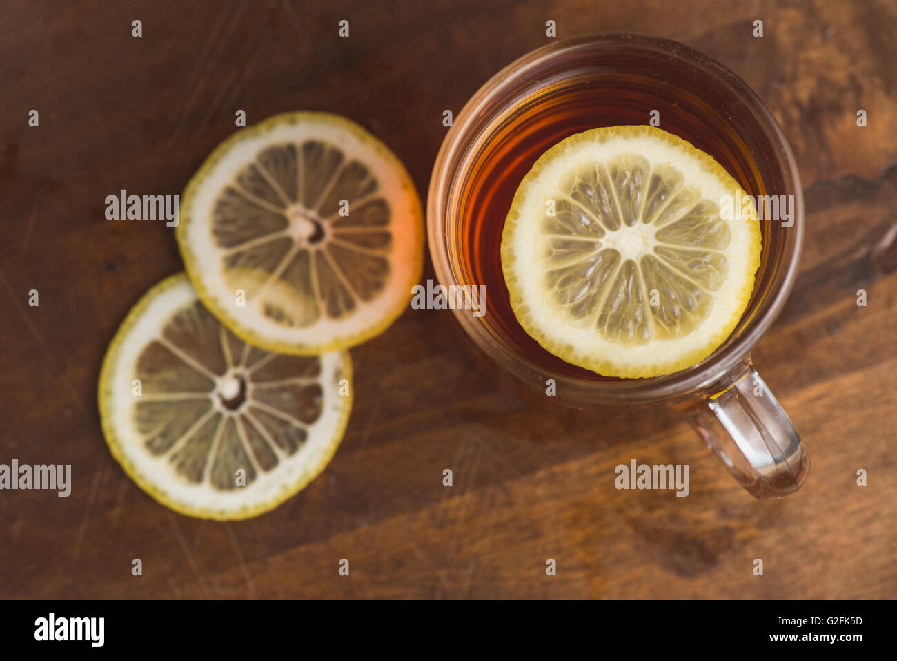 Top view of black tea with lemon in cup and on wooden plank table Stock ...
