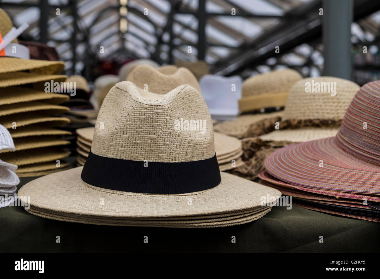Piles of hats on a market stall Stock Photo - Alamy